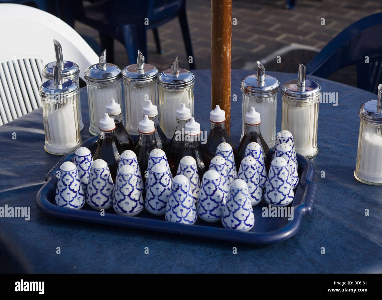 salt pepper and sugar condiments on cafe terrace table Stock Photo - Alamy