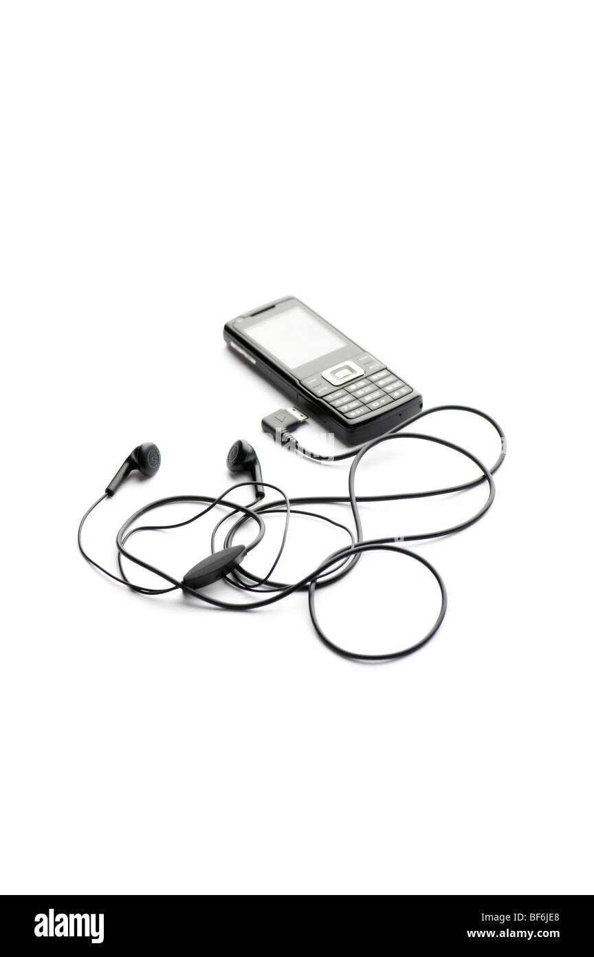 object on white - mobile phone with head set Stock Photo - Alamy