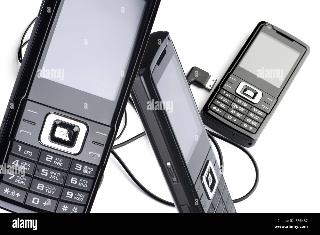 object on white - mobile phone with head set Stock Photo - Alamy