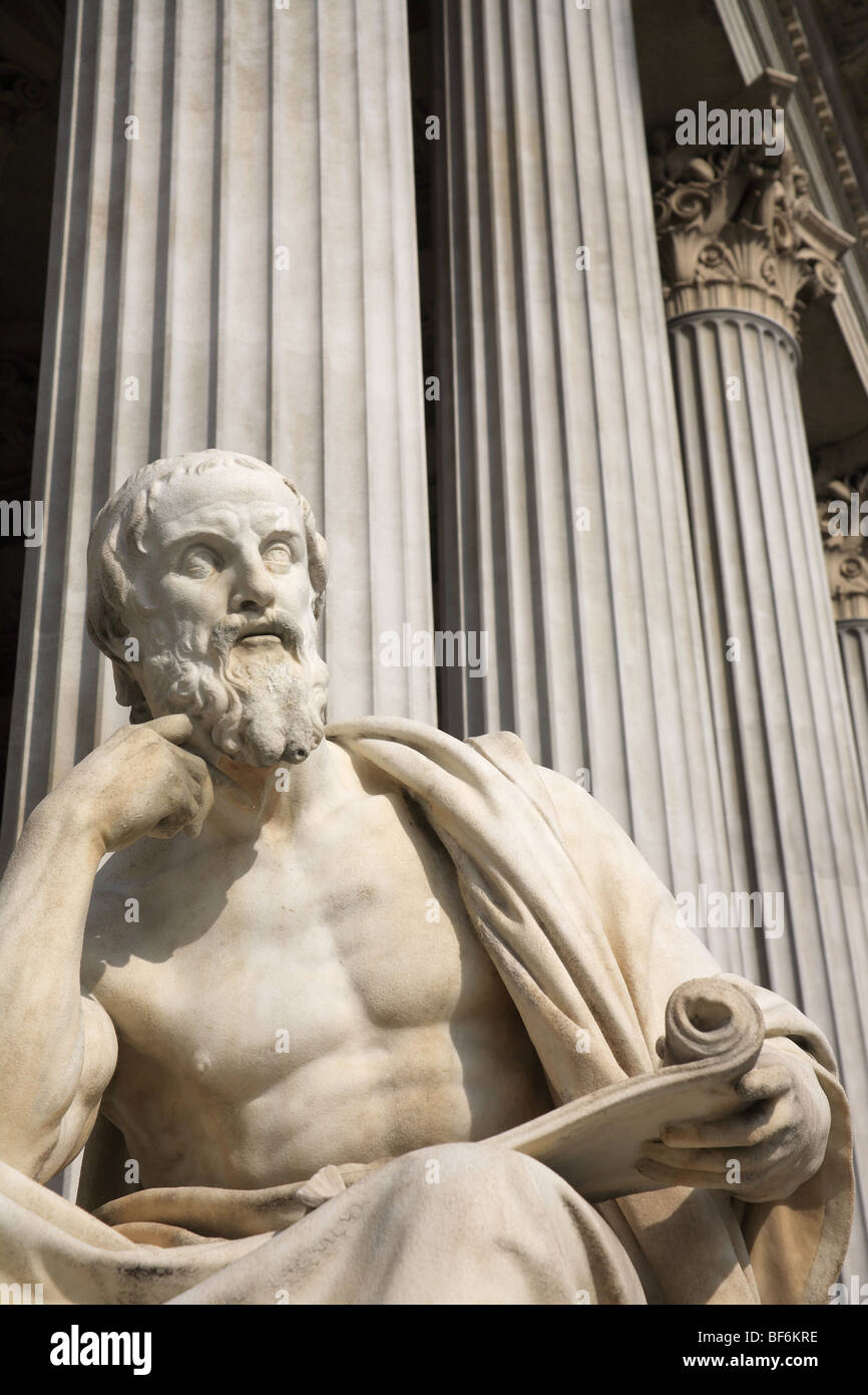 Statue of the Greek philosopher Herodotus in front of the columns to ...