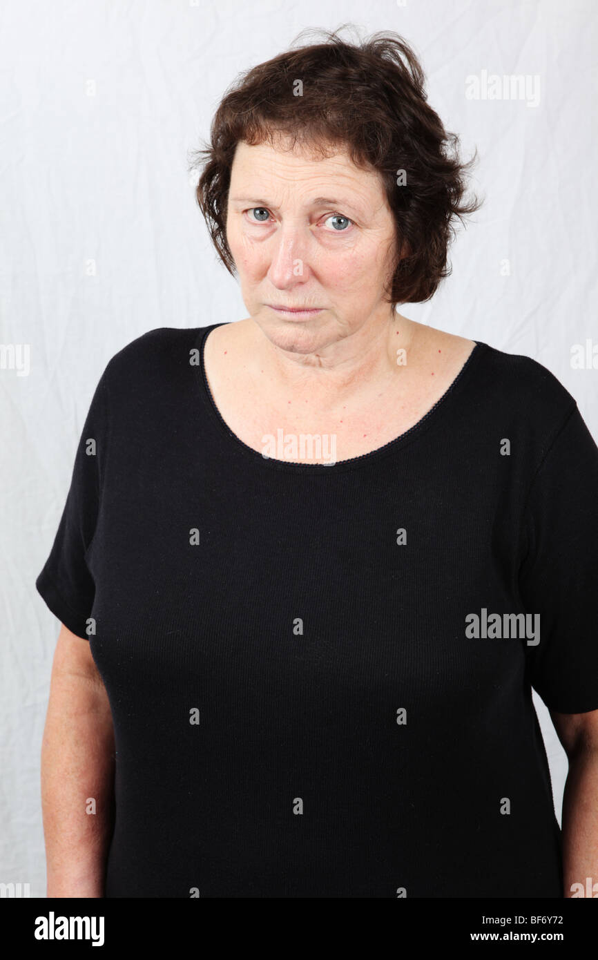 50s 60s woman looking serious staring stern facial expression austere ...