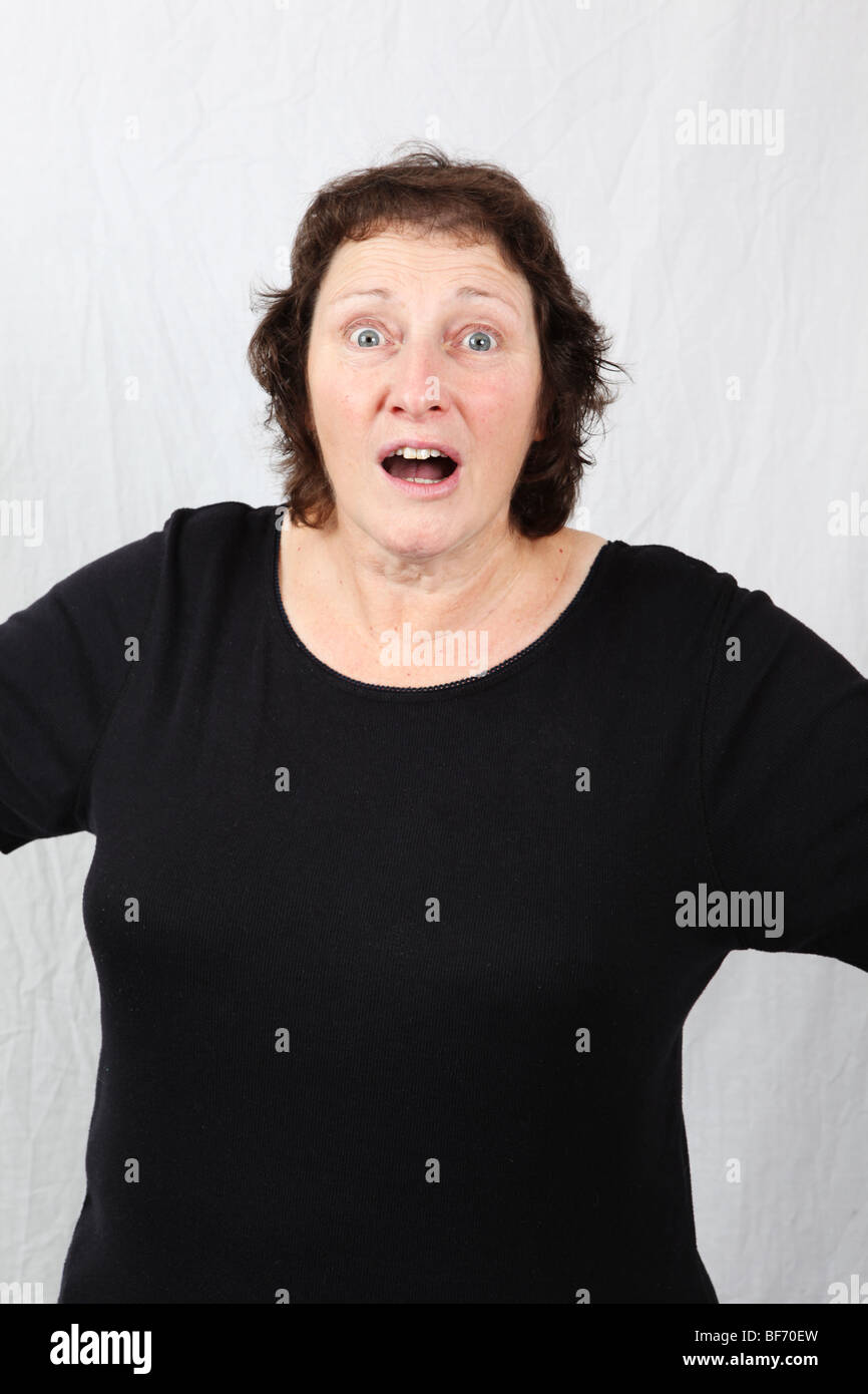 Surprised looking late middle aged woman 50s 60s year old with amazed ...