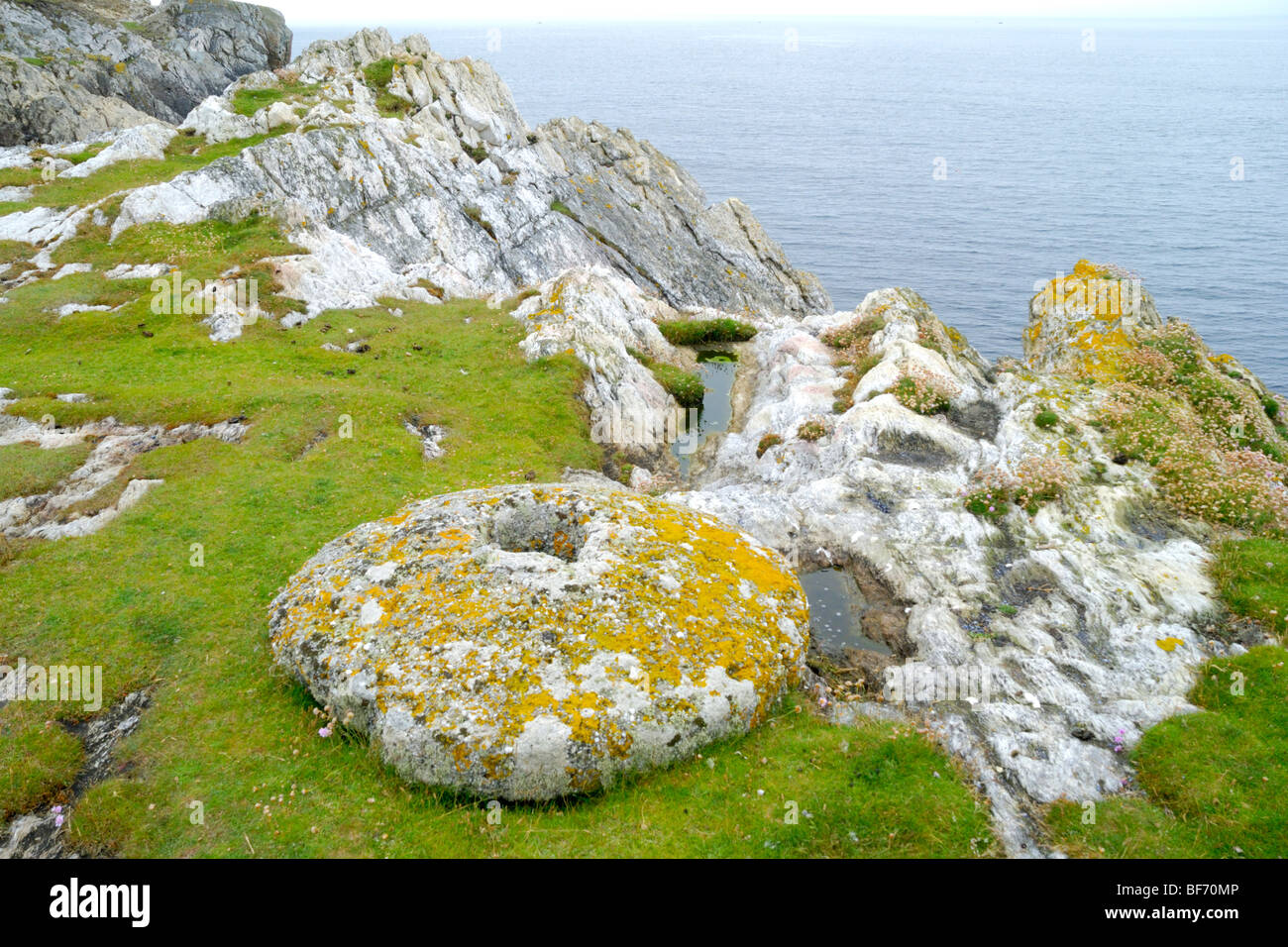 Millstone at Bwa Gwyn, Rhoscolyn, Anglesey, North Wales Stock Photo - Alamy