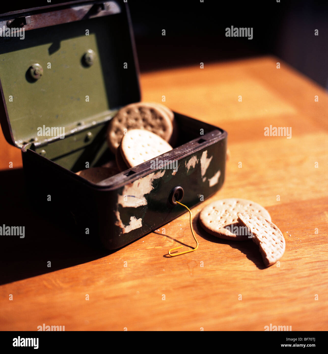 old strongbox picked lock and biscuits Stock Photo - Alamy