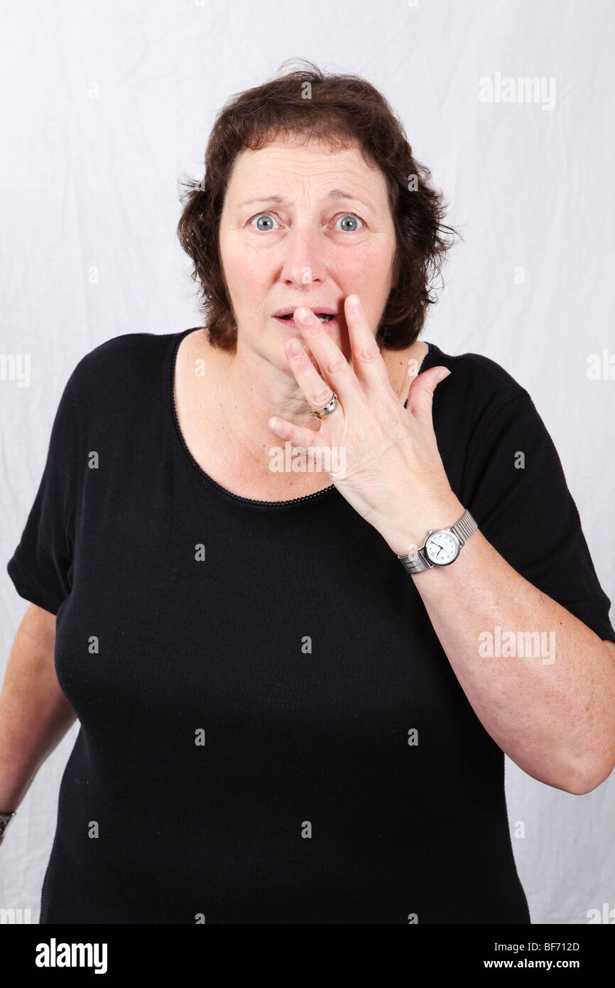 Surprised and shocked looking 50s 60s late middle aged woman aghast ...