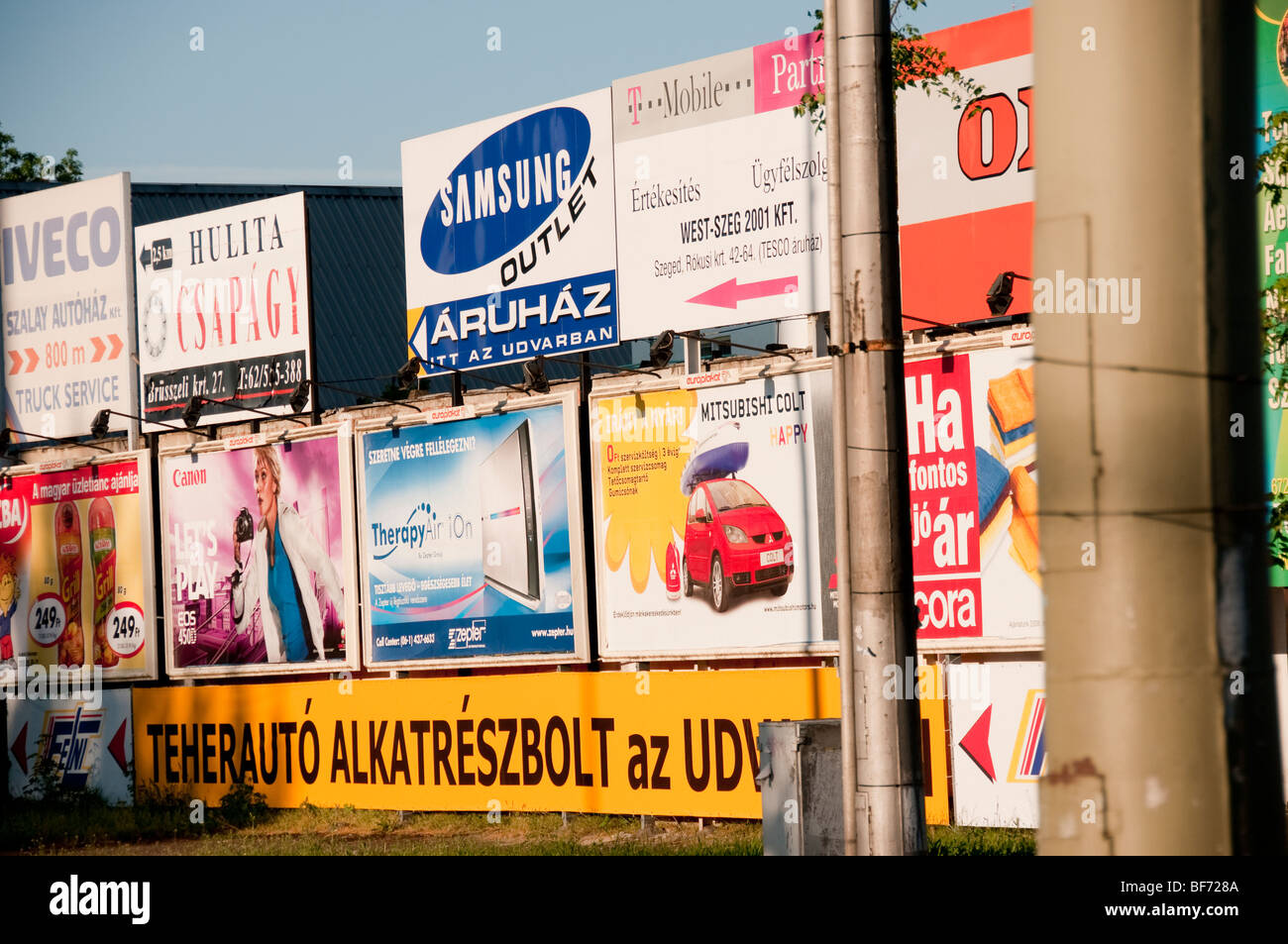 Advertising signs on wall in Szeged Hungary Stock Photo - Alamy