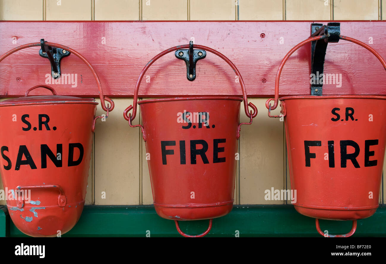 Three Southern Rail fire buckets Stock Photo - Alamy
