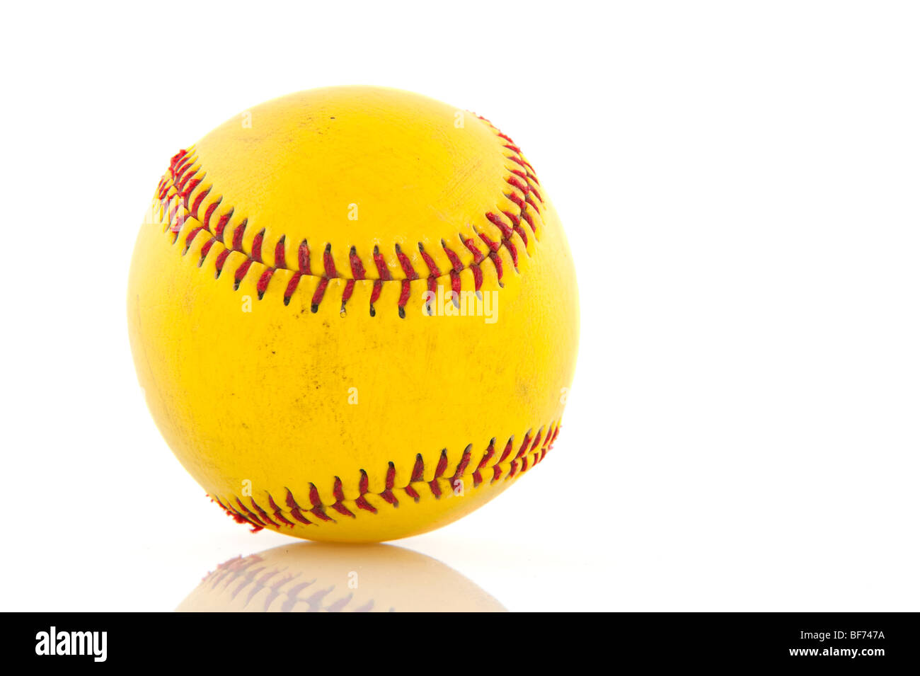 Yellow baseball as sport attribute isolated over white Stock Photo - Alamy