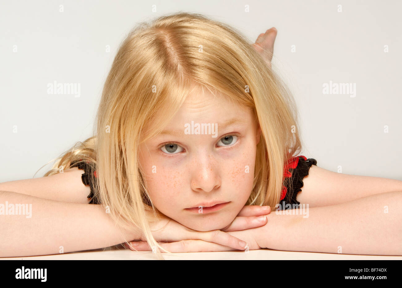 Young caucasian girl looking wistful, sad Stock Photo - Alamy