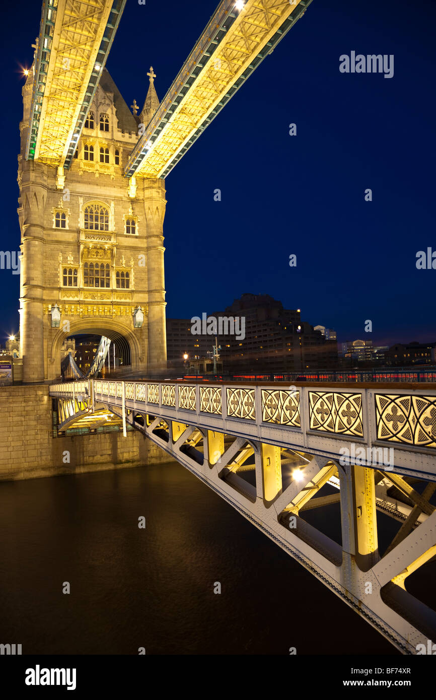 Looking up at the structure of Tower Bridge in London at night Stock ...