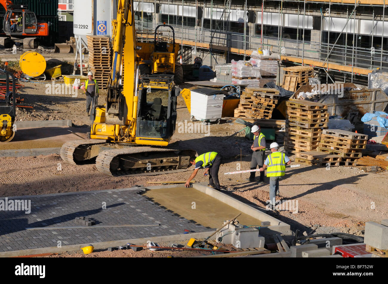 Laying block paving on building site for new Lidl supermarket Croydon ...