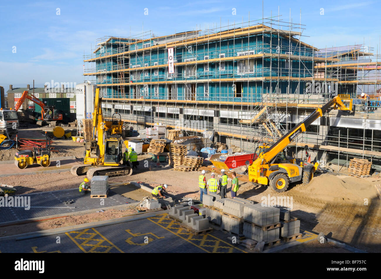 Laying block paving on building site for new Lidl supermarket Croydon ...