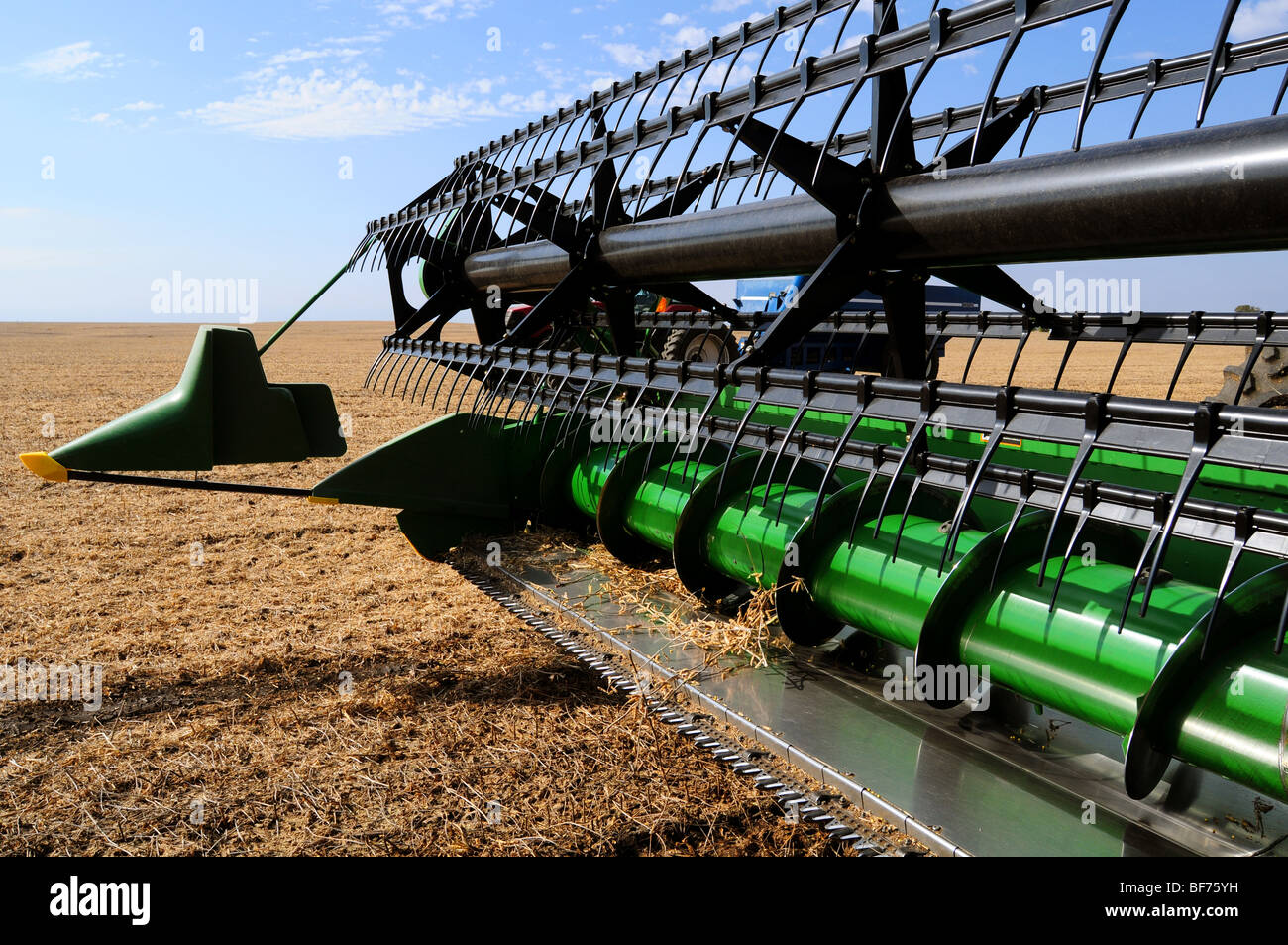 The harvesting head of a John Deere combine during soybean harvest ...