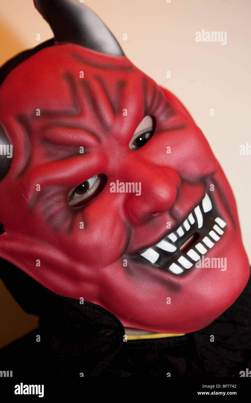 Halloween mask and RIP grave headstone Stock Photo - Alamy