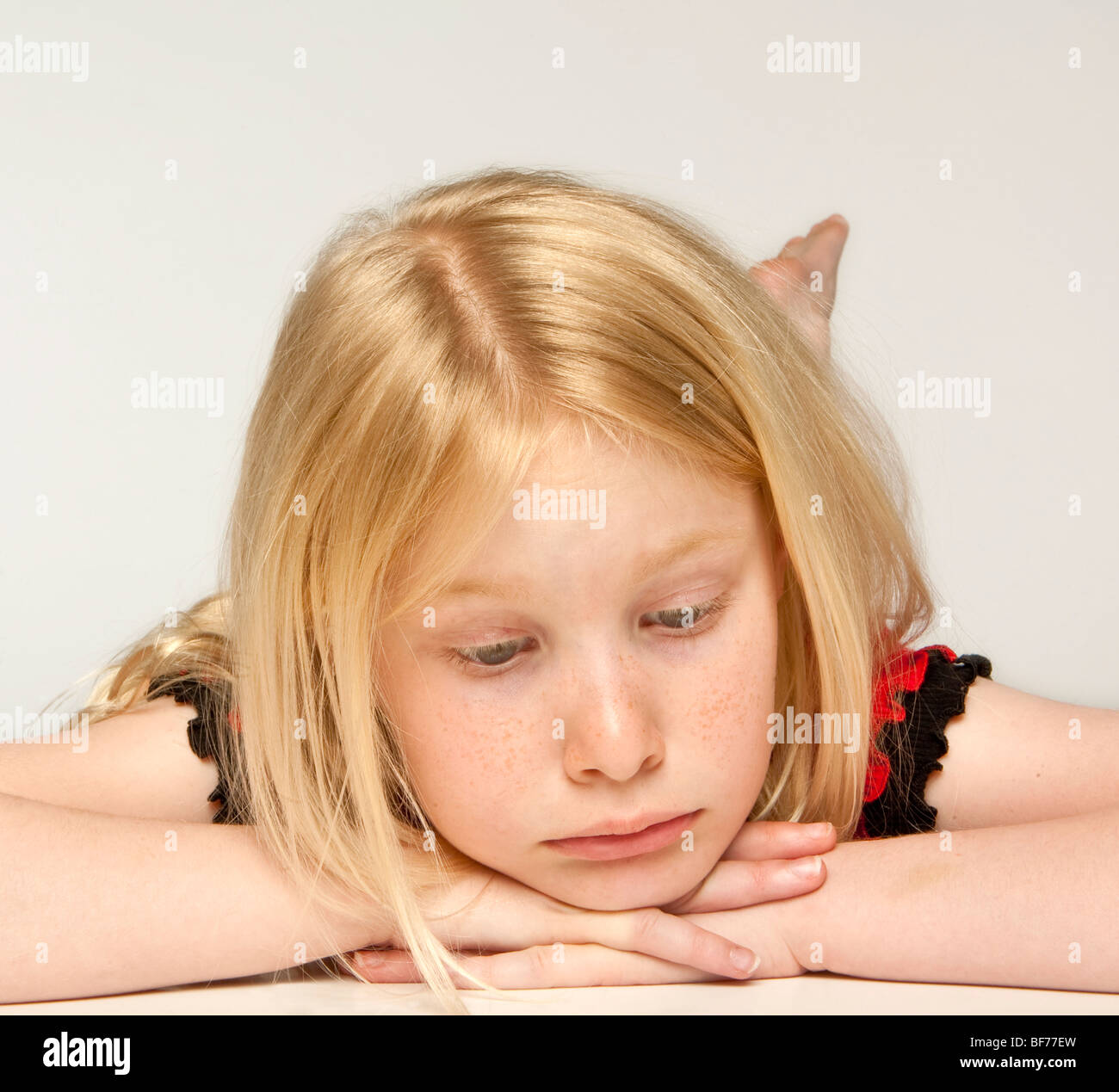 Young caucasian girl looking wistful, sad Stock Photo - Alamy