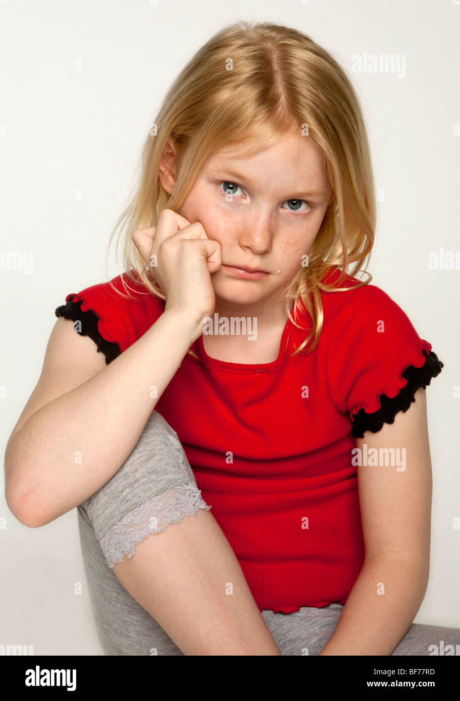 Young caucasian girl looking wistful, sad Stock Photo - Alamy