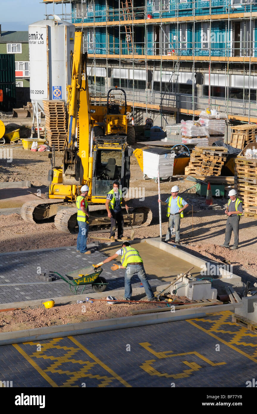Laying block paving on building site for new Lidl supermarket Croydon ...