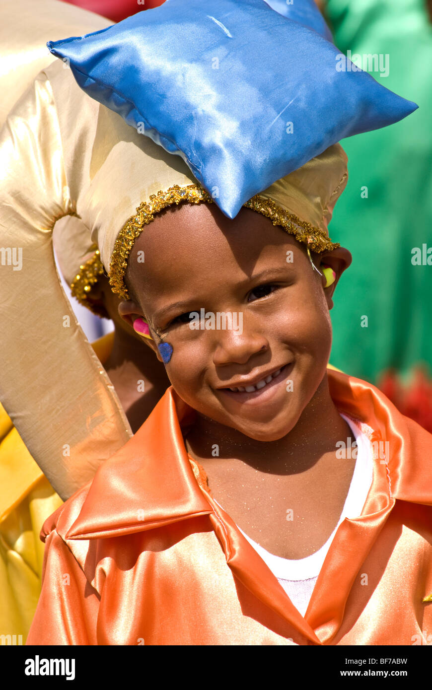Child smiling shyly during the Carnival parade, Curacao Stock Photo - Alamy