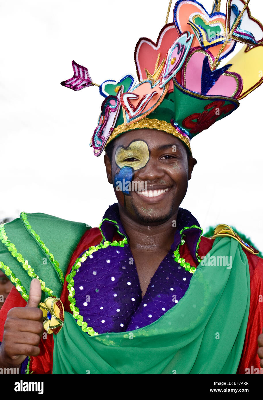 Spectacular head gear and face make up worn by this happy, smiling guy ...