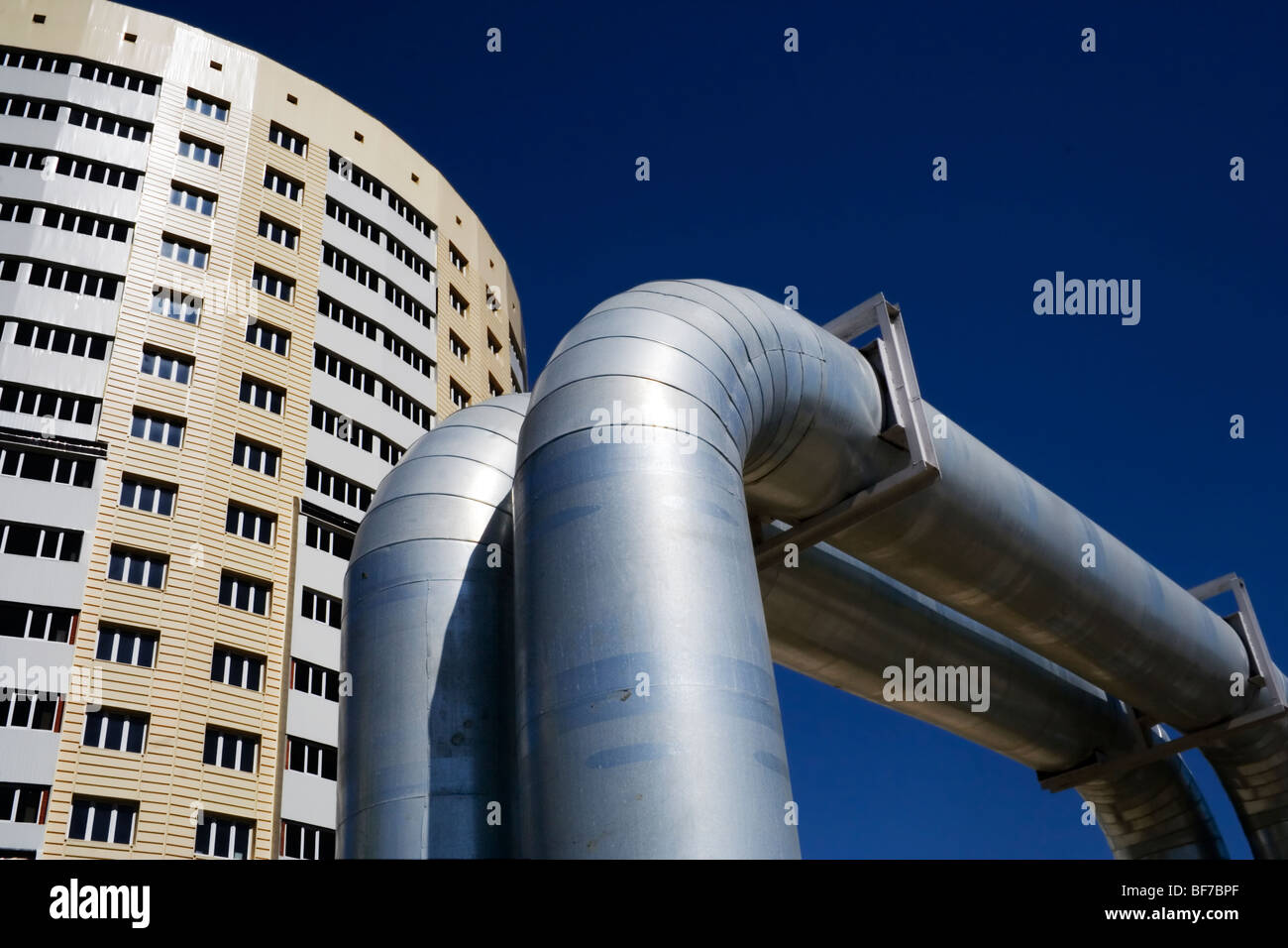Big pipeline and new building Stock Photo - Alamy