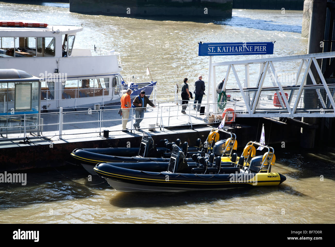 Pleasure boats at St Catherines Wharf Tower Bridge, London Stock Photo ...