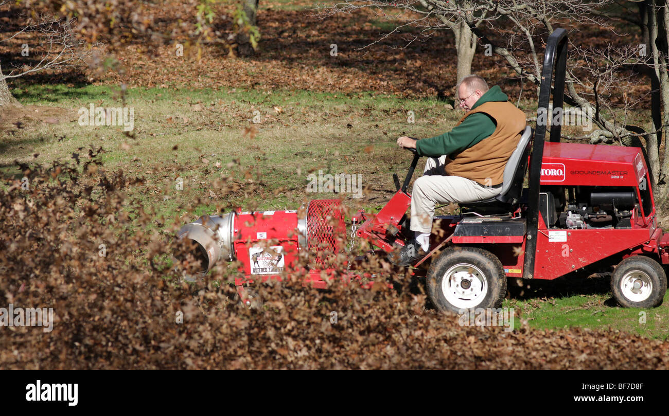 A Toro groundsmaster 328-D fitted with a front power leaf blower ...