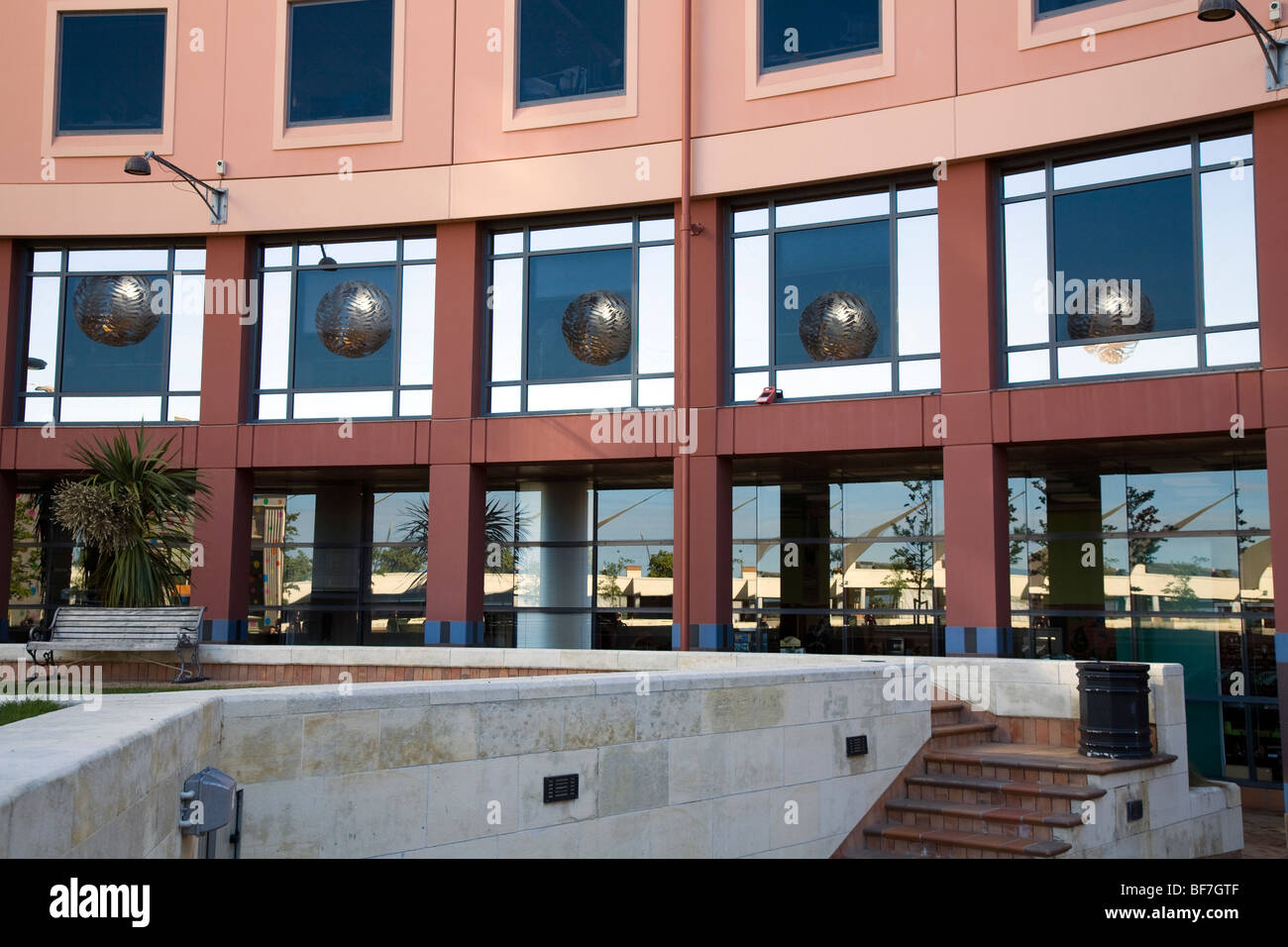 Reflection of Neil Dawson's silver fern globe "Ferns" in windows ...