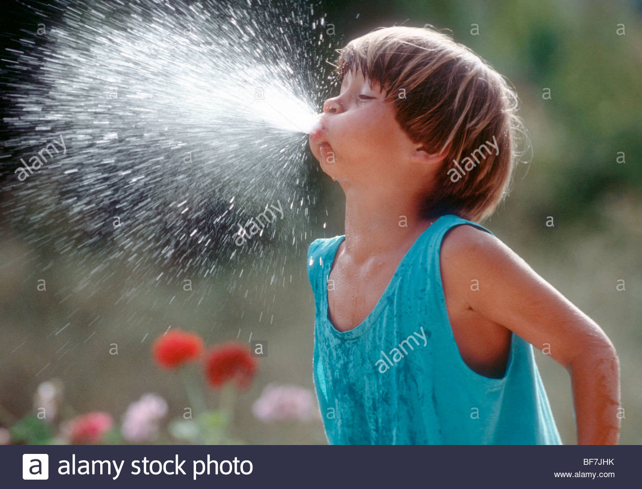 A boy is spitting with water Stock Photo: 26598479 - Alamy