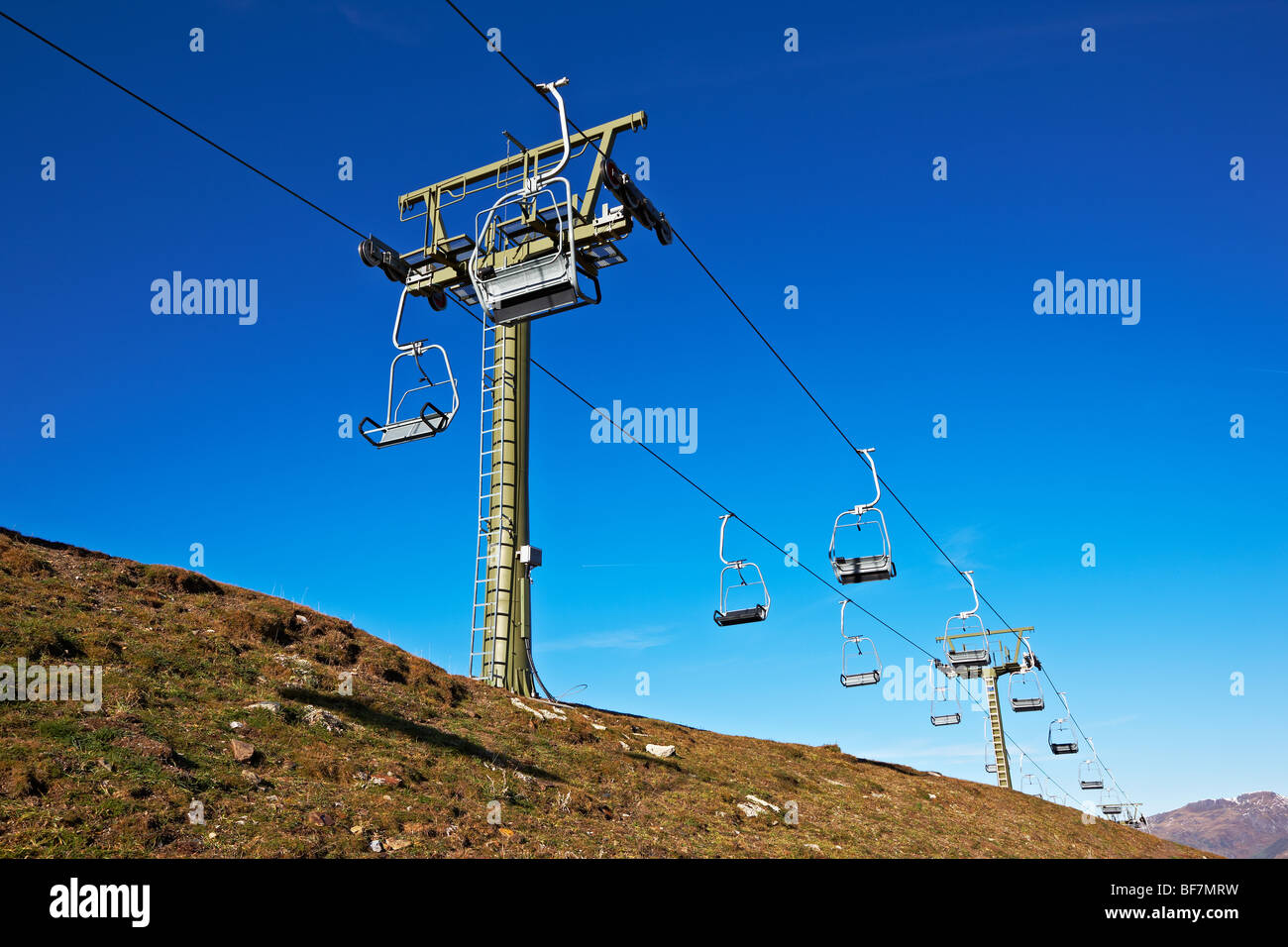 Ski lift tower under high mountains, Spain Stock Photo - Alamy