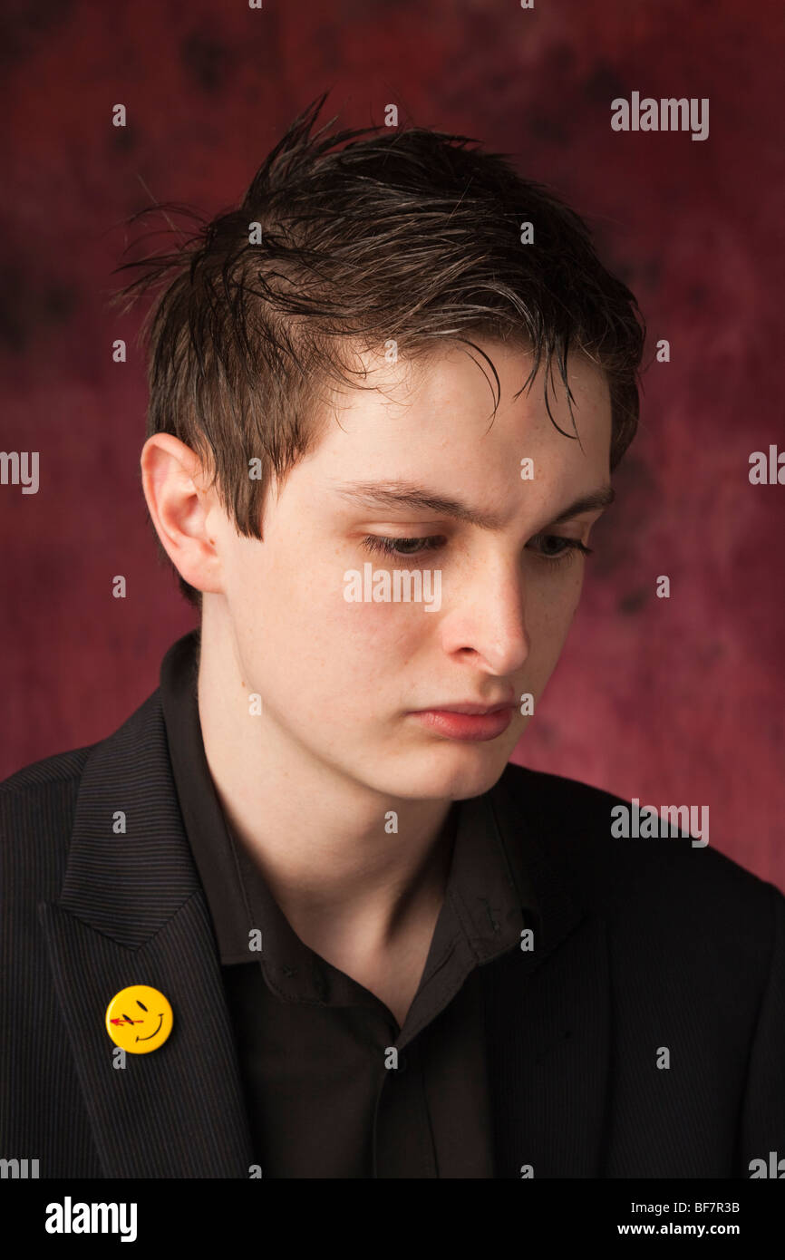 Studio, UK, Britain. Head and shoulders portrait of a young man with a ...