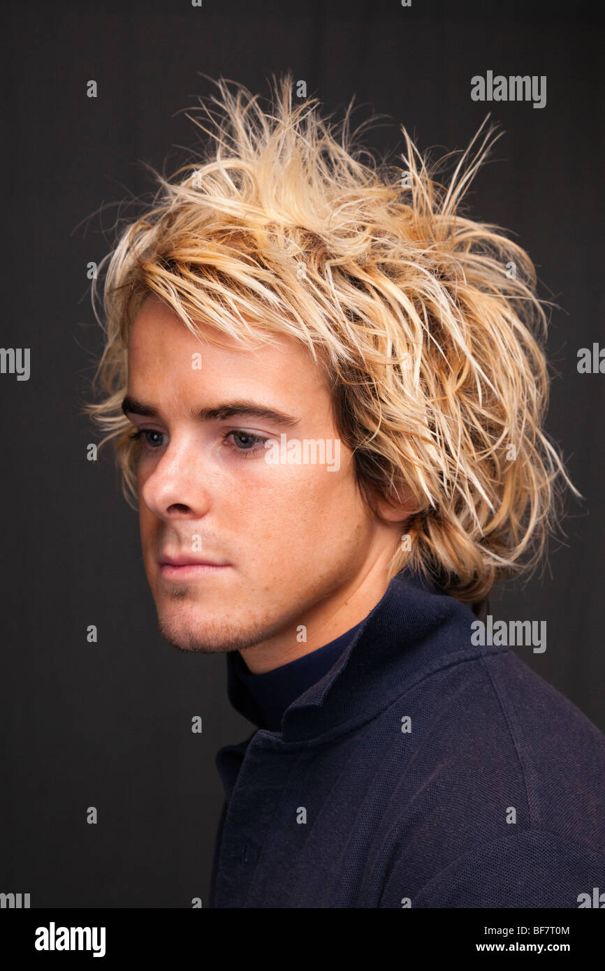 Studio, UK, Europe. Head and shoulders portrait of a young man posing ... Studio, UK, Europe. Head and shoulders portrait of a young man posing ...