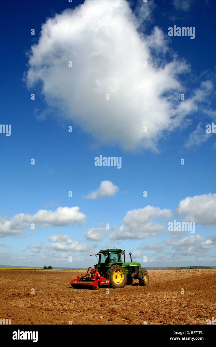 Tractor in a field Stock Photo - Alamy