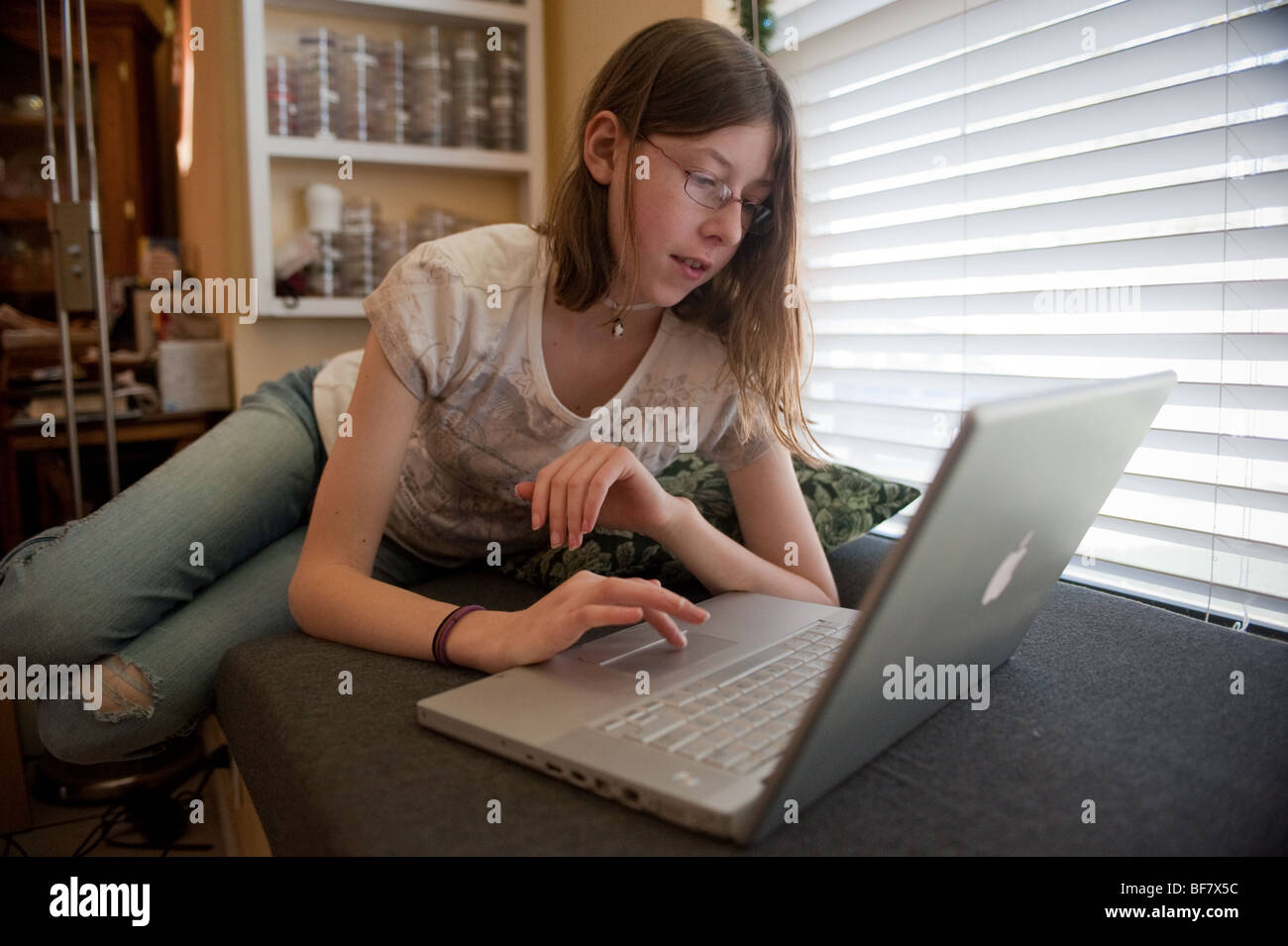 Girl working on laptop computer Stock Photo - Alamy