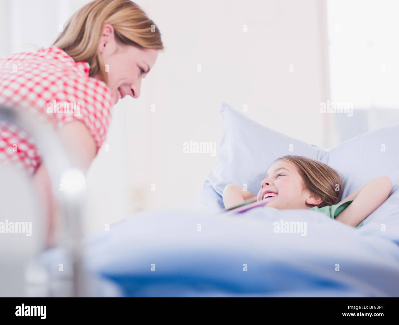 mother looking at daughter Stock Photo - Alamy