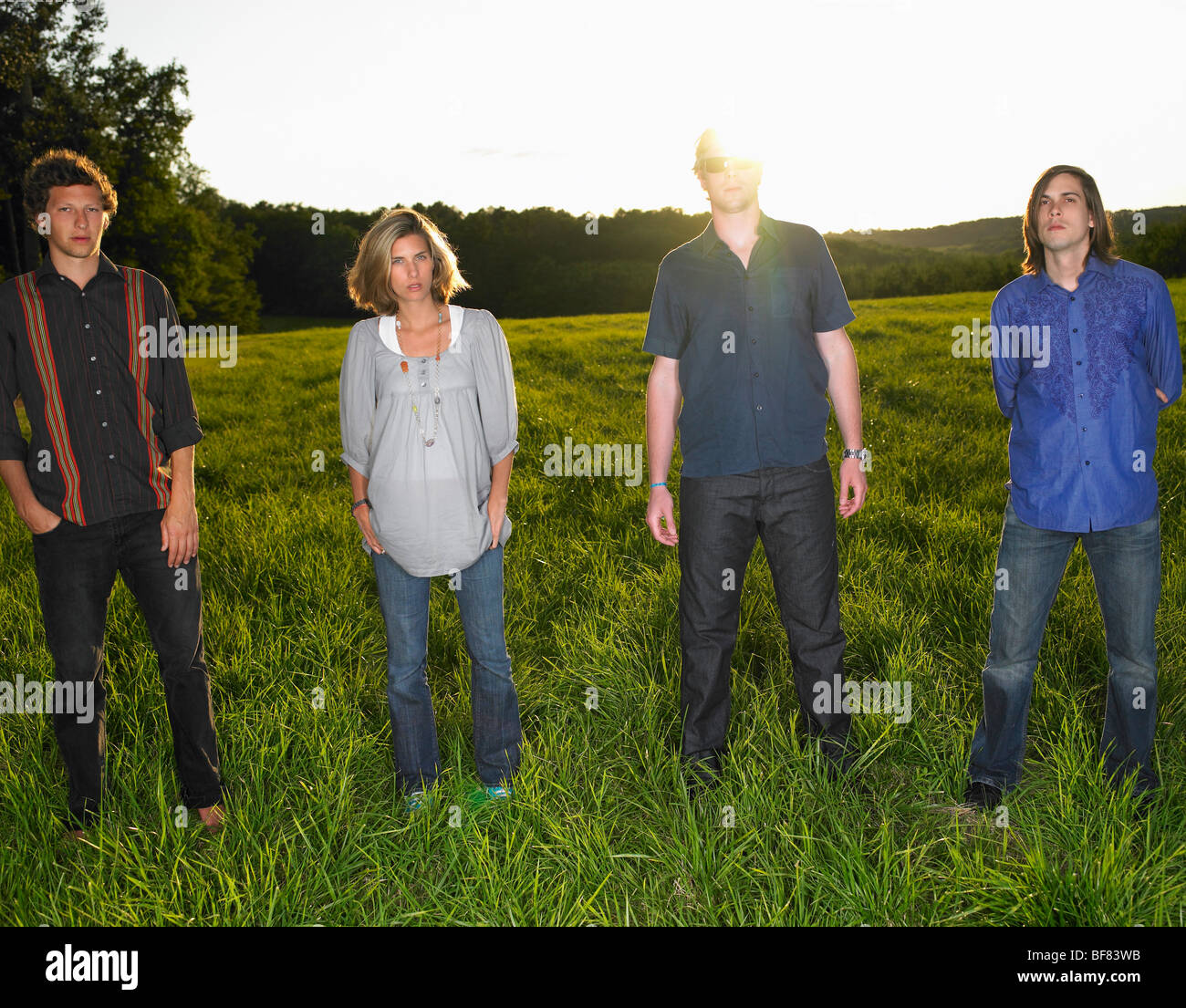 Group of people standing in a field Stock Photo - Alamy