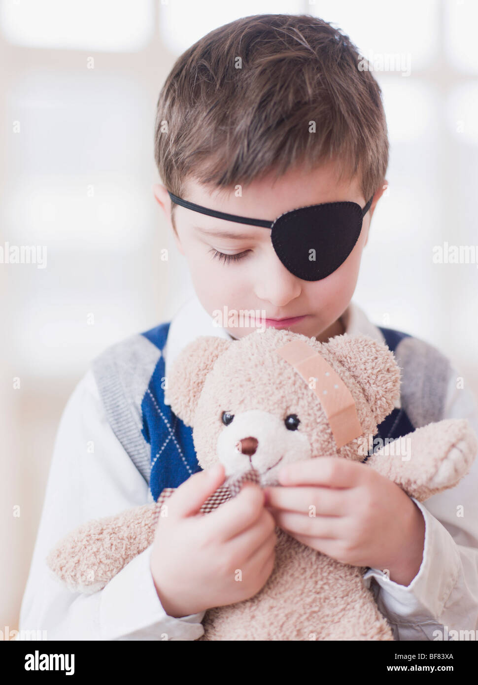 boy holding teddy bear Stock Photo - Alamy