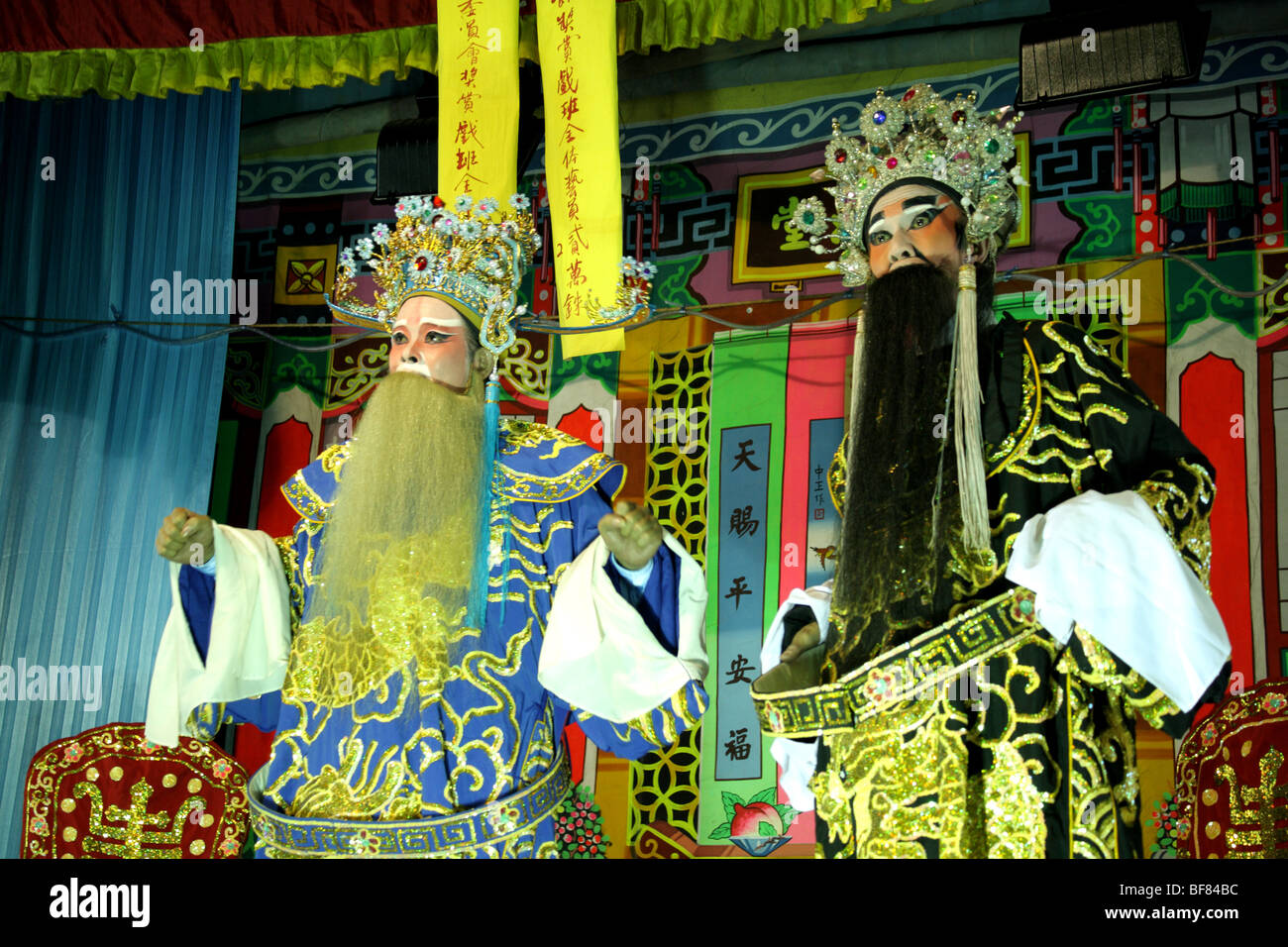 Chinese opera performers showing on stage , Bangkok 's Chinatown ...