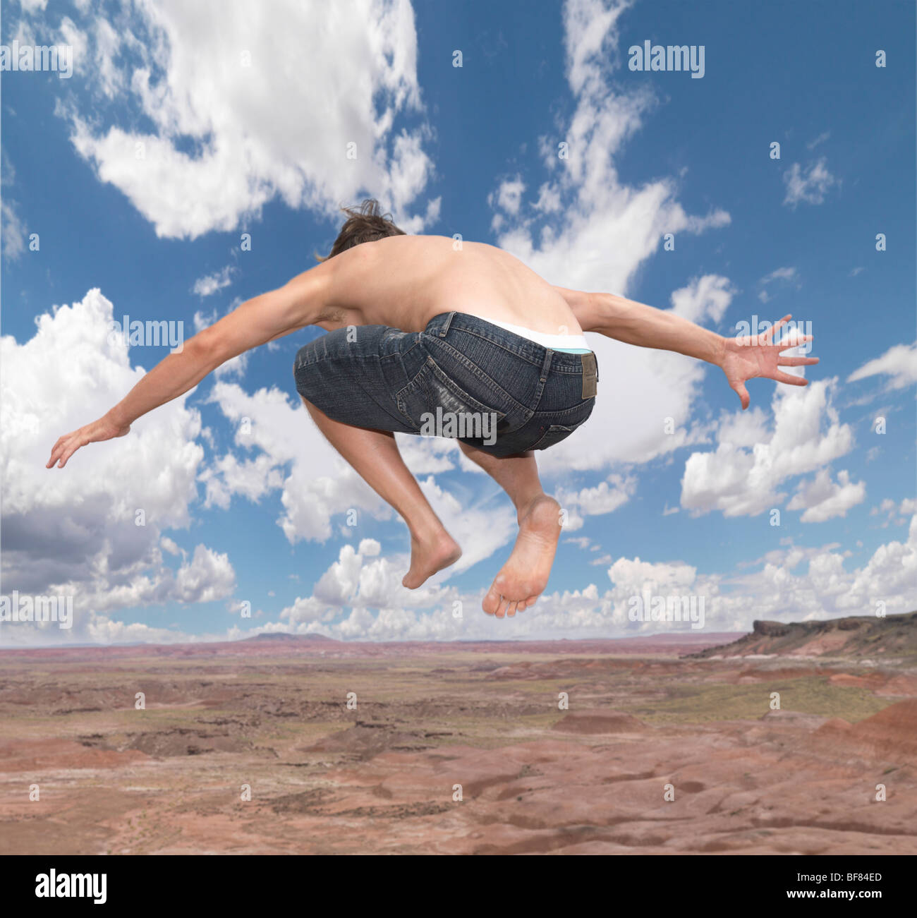 Man leaping in desert Stock Photo - Alamy