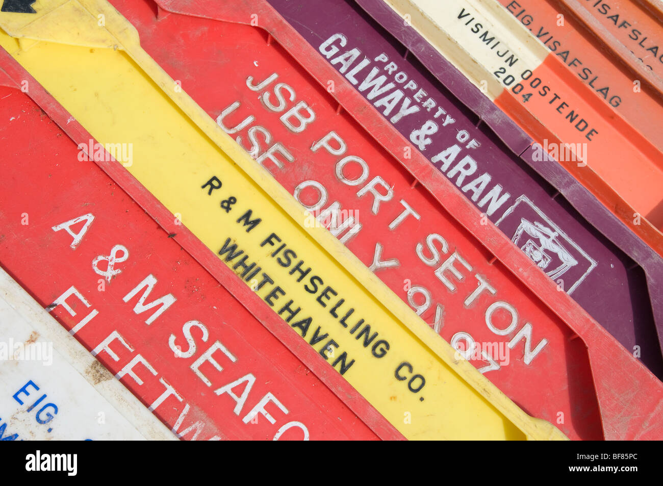 Stacked colourful fish boxes from a fishing boat Stock Photo - Alamy