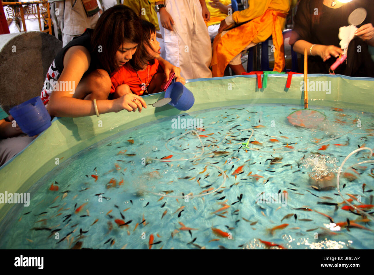 Children playing Fishing Game , Bangkok 's Chinatown , Thailand Stock ...