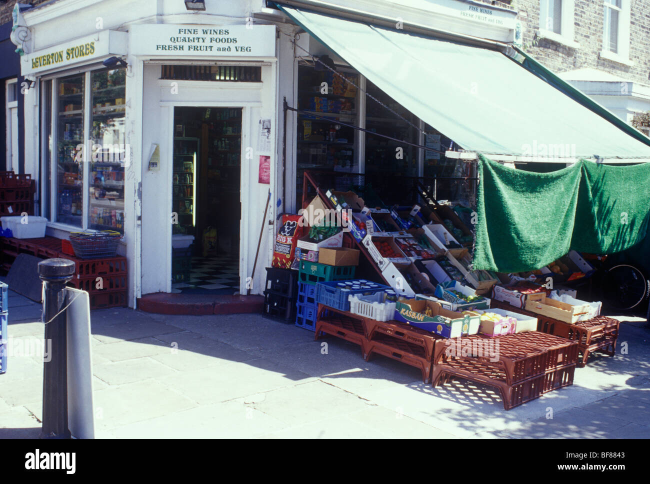 typical city corner shop in north London with groceries on pavement and ...