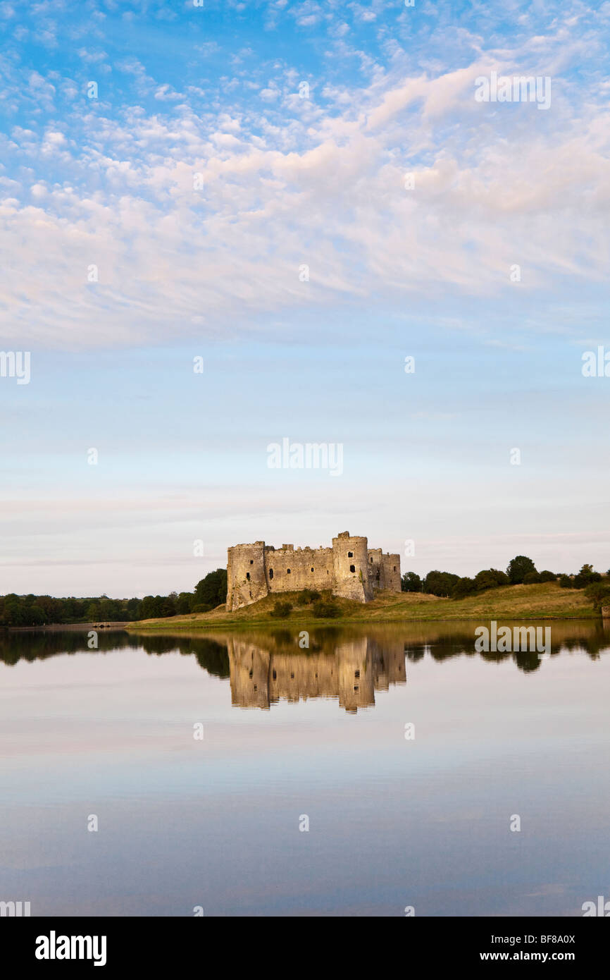 The last of the evening sunlight reflecting off Carew Castle beside the ...
