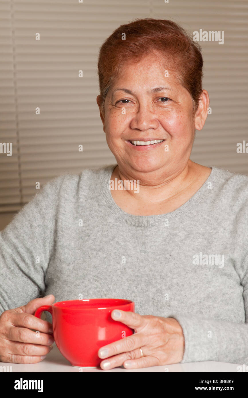 Smiling friendly senior woman Stock Photo - Alamy