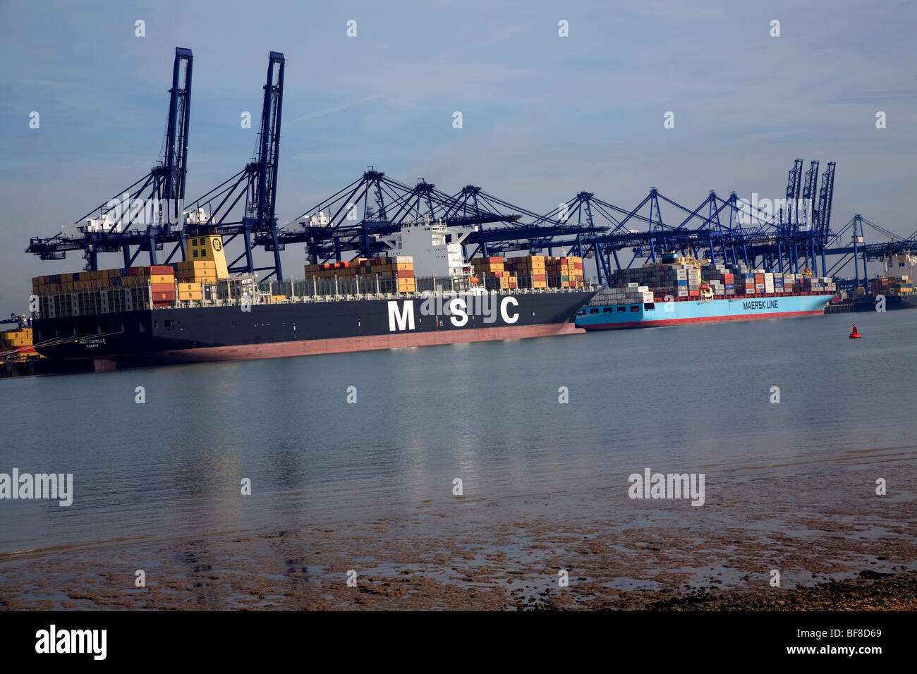 Container ships cranes Port of Felixstowe, Suffolk viewed from across ...