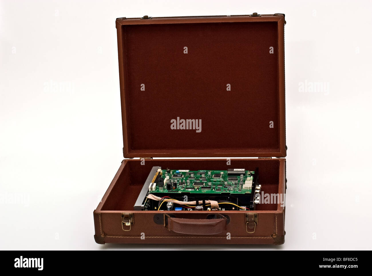 Small DVD unit inside a brown suitcase Stock Photo - Alamy