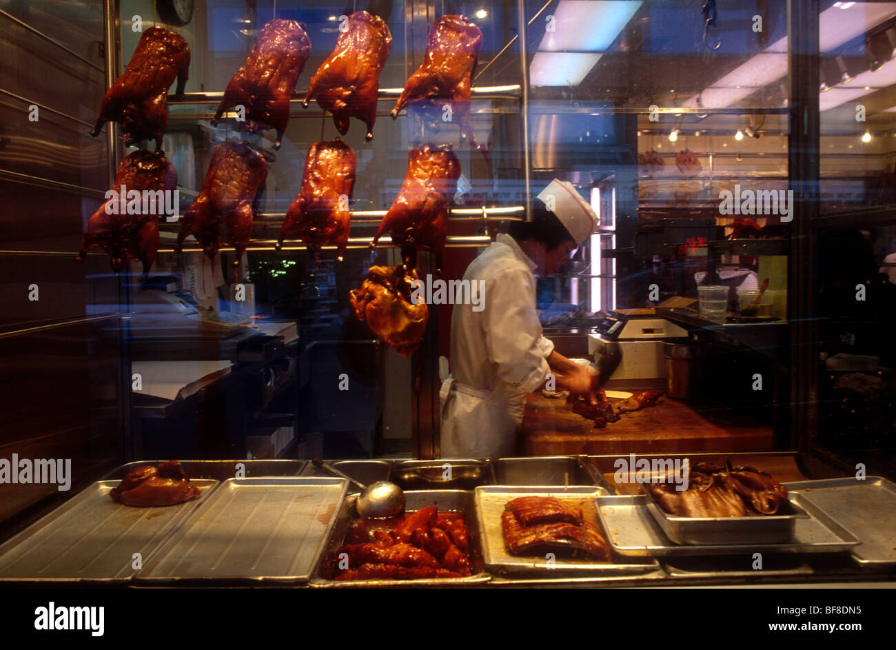 barbecue ducks hanging in display in Chinese restaurant window in ...