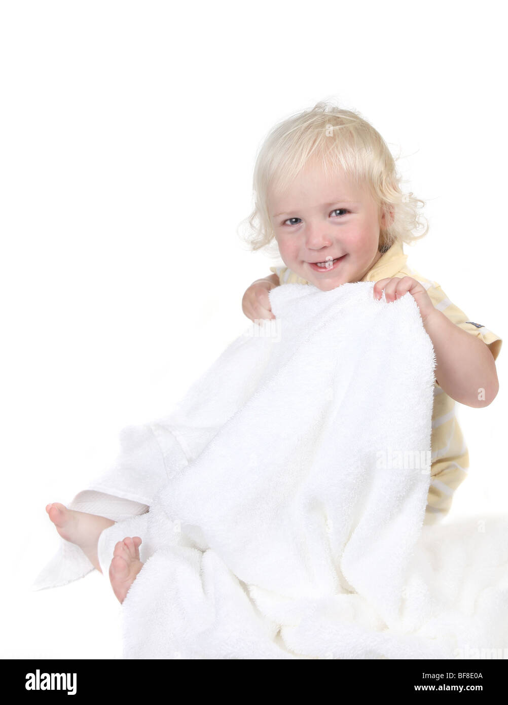 Happy Kid Holding a Bath Towel Smiling on White Stock Photo - Alamy