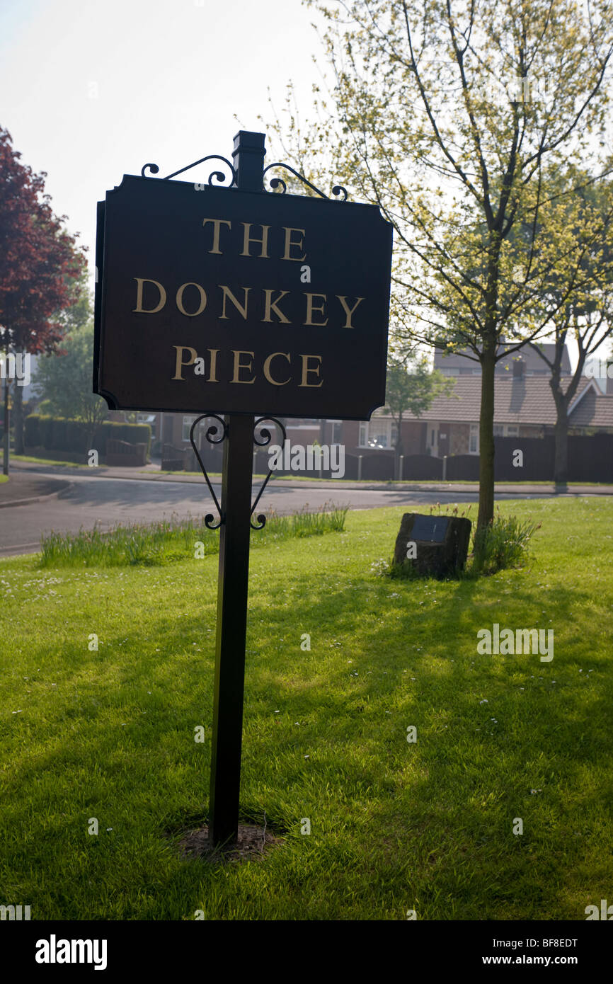 The Donkey Piece. An unusual signage, signage on the village green in ...