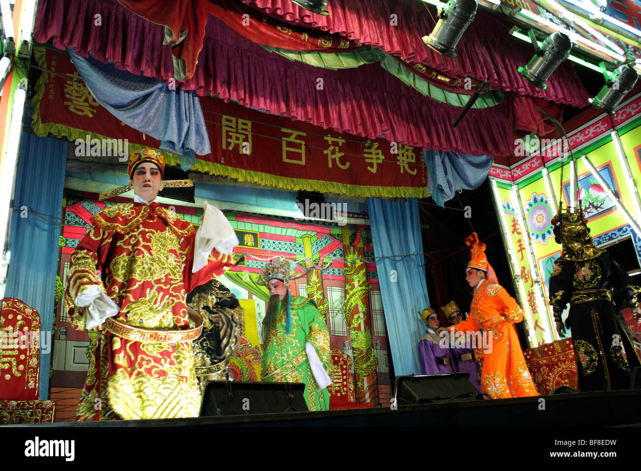 Chinese opera performers showing on stage , Bangkok 's Chinatown ...