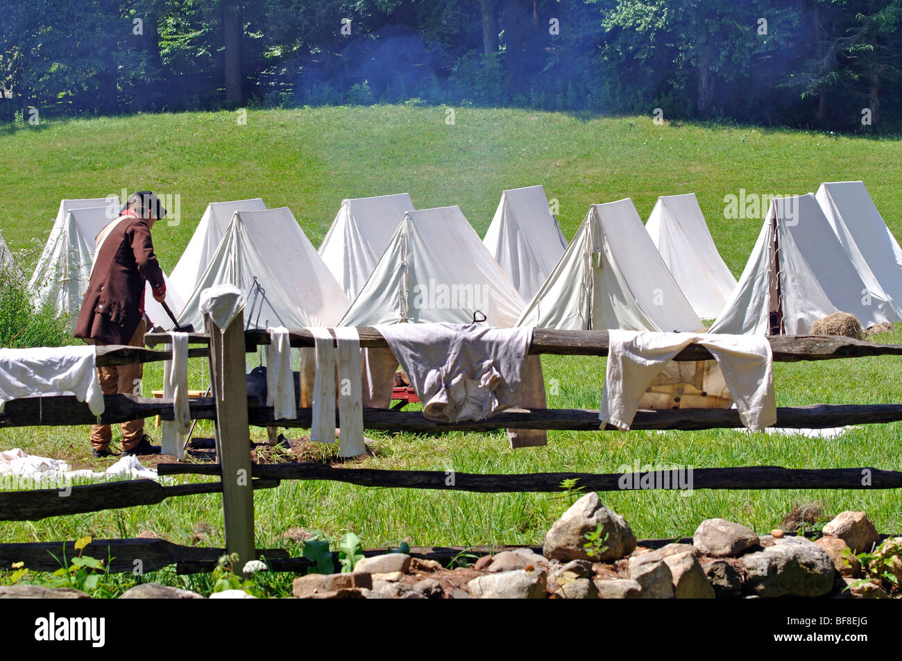 Clothes drying on fence in military tent camp - costumed American ...